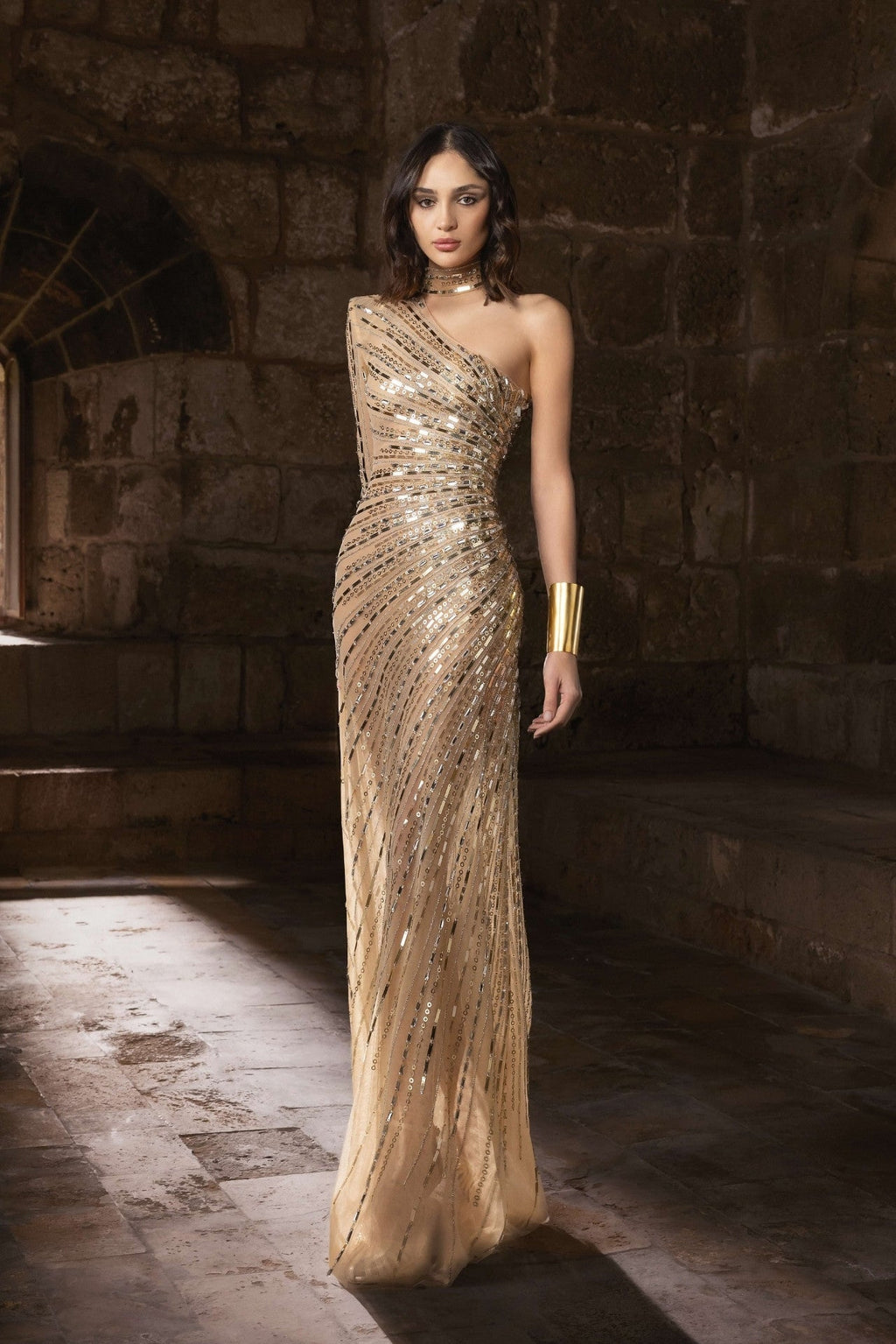 Fitted gown with asymmetrical neckline, structured bodice, and sequin ...