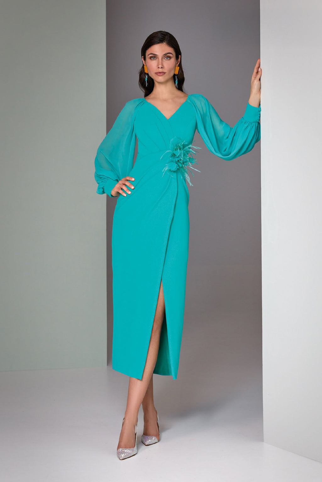Wrap dress with voluminous sleeves, floral waist accent, and front sli ...