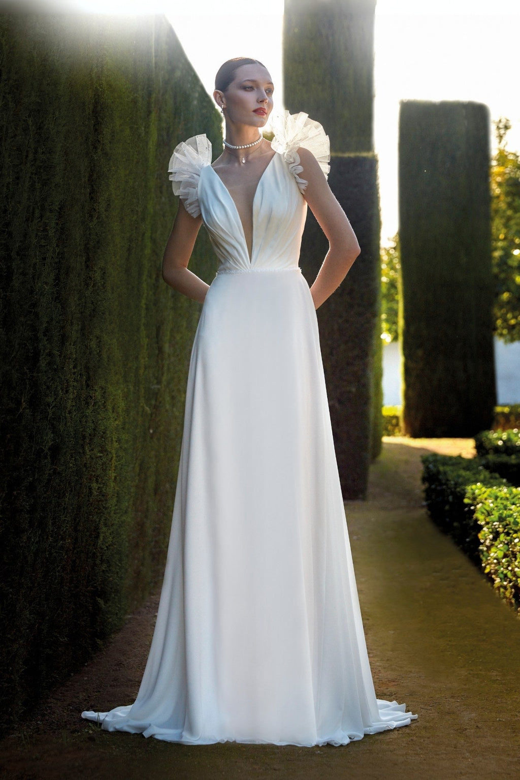 White Gown With Dramatic Puff Sleeves And Deep Neckline – HERTROVE