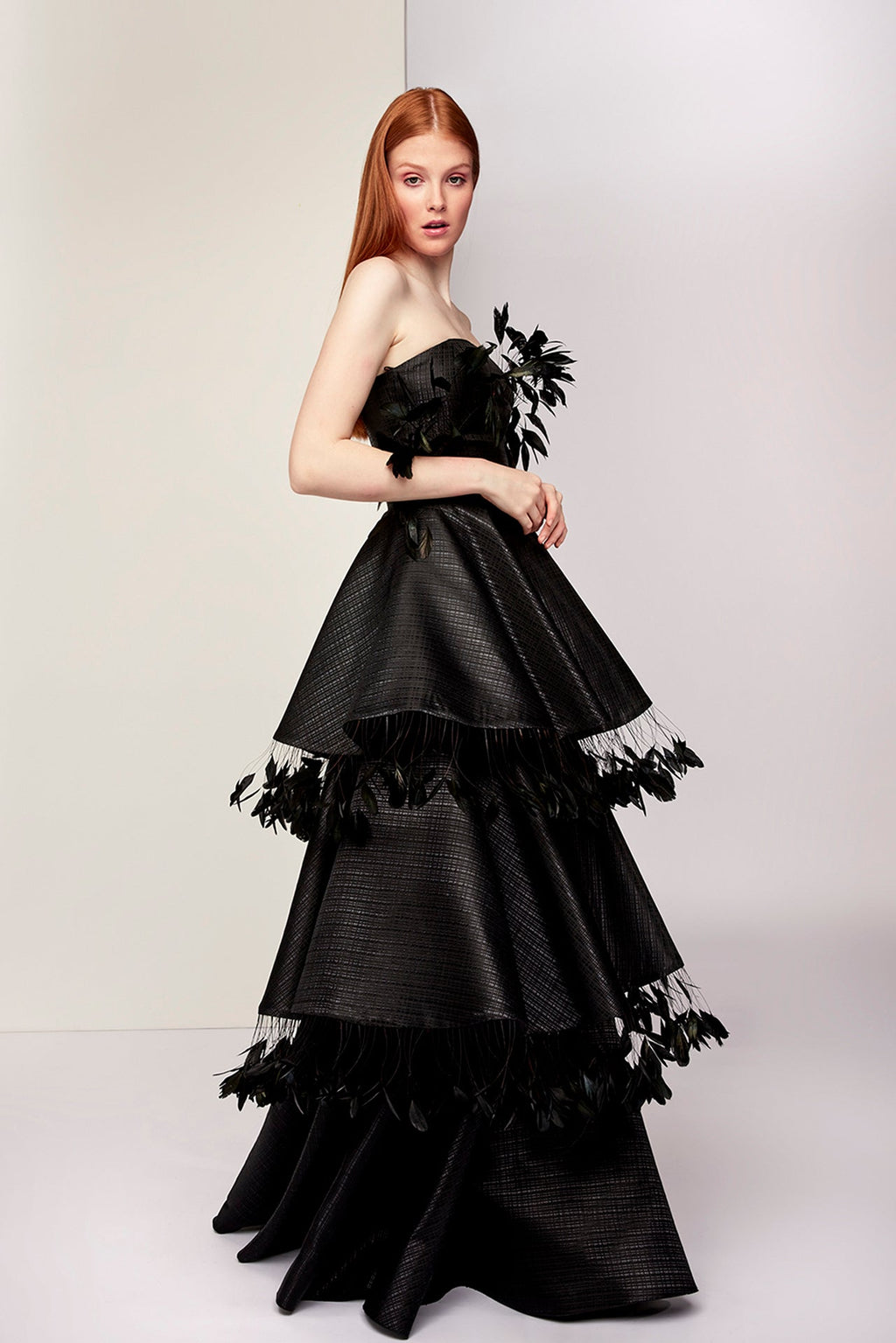 Feather detailed strapless tiered gown – HERTROVE